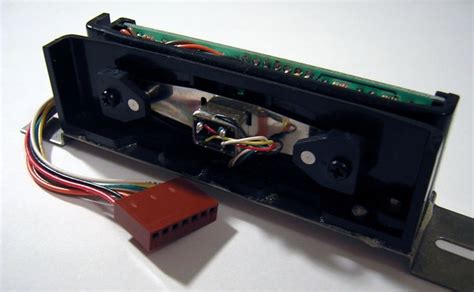 An Electronic Device With Wires Attached To The Back Of Its Housing And Wiring