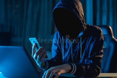 Anonymous Hacker Programmer Uses A Laptop To Hack The System In The