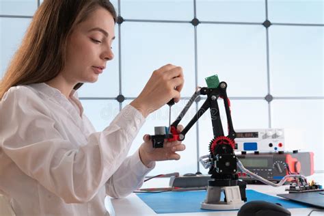 A Young Woman Writes An Algorithm For The Robot Arm Science Research