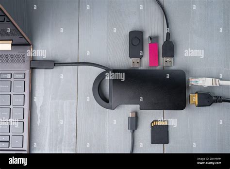 USB Type C Adapter Or Hub Connected To The Laptop With Various