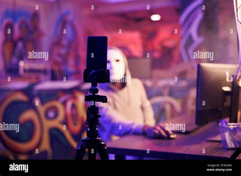 Anonymous Criminal Recording Scam On Smartphone Camera In Abandoned Warehouse Hacker With