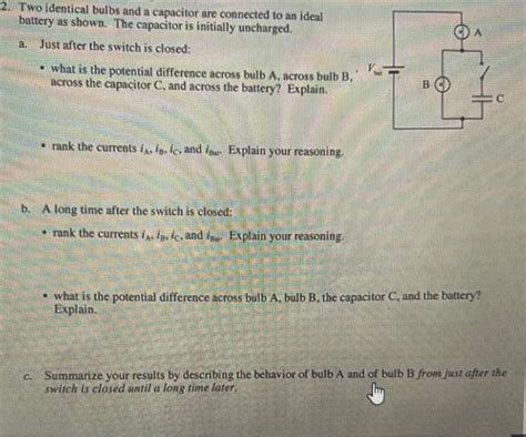 Solved Two Identical Bulbs And A Capacitor Are Connected To