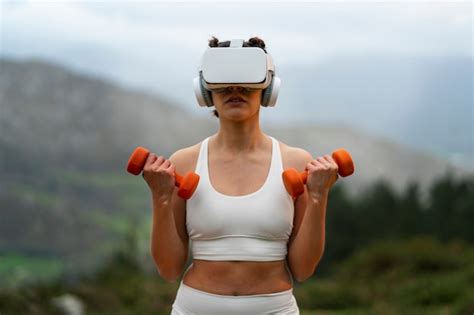 Free Photo Woman Using Vr Glasses To Exercise Outdoors With Weights