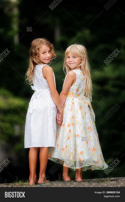 Two Girls In Love Holding Hands