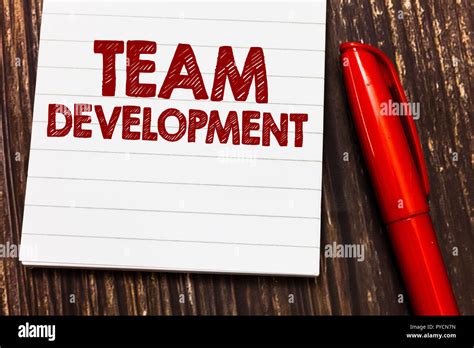 conceptual hand writing showing team development business photo