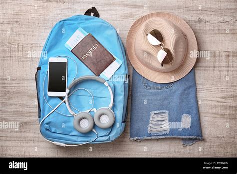 Composition With Smartphone Passport And Baggage On Wooden Background