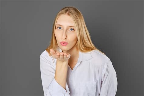 Premium Photo Top View Of Blonde Woman Blowing A Kiss