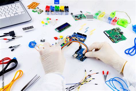 Engineer Is Connecting Microchip To Microcontroller Mannually Microcontrollers Chips