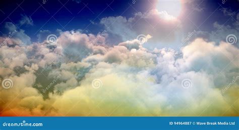 Idyllic View Of Bright Sun Over Clouds During Sunny Day Stock Image