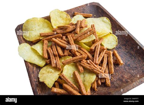 Delicious Potato Chips And Salted Rye Bread Crackers On A Dark Wooden