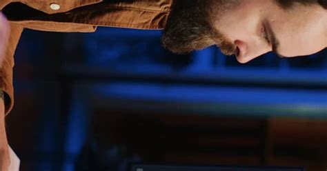 Focused Programmer Drinking Coffee In Apartment While Solving Database Errors Technology Stock