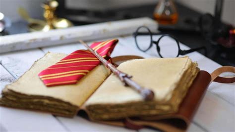 Download Wizard School Spellbookand Wand Wallpaper