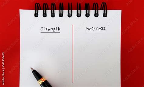 pen on note book with text written strength and weakness concept of