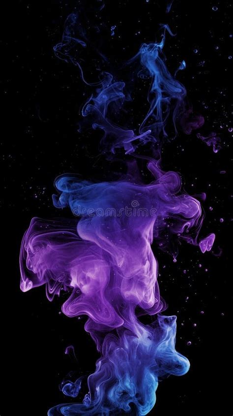 Colorful Ink Is Swirling In Water Creating Abstract Shapes And Patterns Against A Black