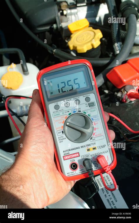 Digital Voltmeter Reading Of 12 Volt Car Battery Stock Photo Alamy