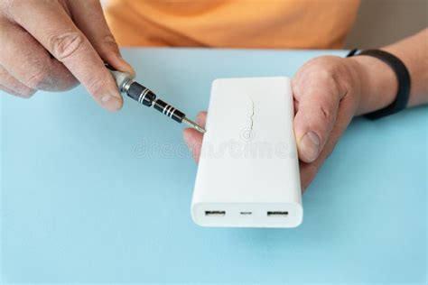 Power Bank In Hand A Battery That Has Become Unusable Expands And Swells Until The Case Breaks