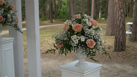 Beautiful Flower Arrangement With Decorative Rose Bouquets In White