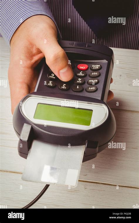 Man Entering His Pin On Terminal Stock Photo Alamy