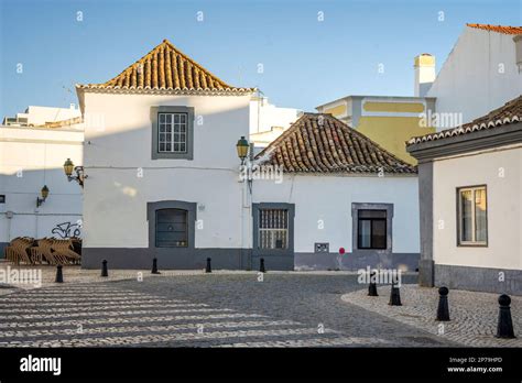 Historic Street In Faro With Traditional Portuguese Architecture