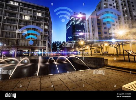 Network City And Wireless Internet At Night With Neon Overlay Lights And Connection For