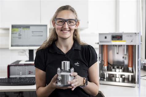Employee Measuring The Electrical Conductivity Of Powder Samples In The Laboratory