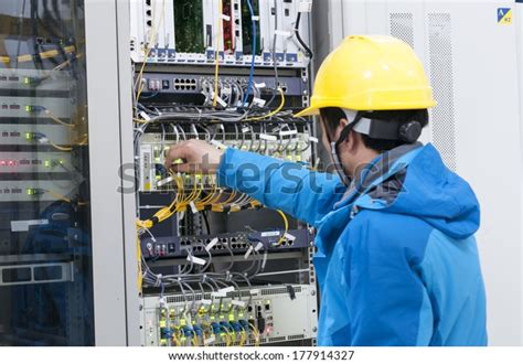 Man Connecting Network Cables Switches Stock Photo Shutterstock
