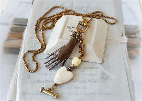 Chunky Assemblage Necklace With Heart And Hand Love Token Hand