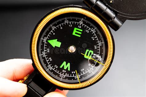 Vintage Compass Displayed In Hand Navigating With Precision For