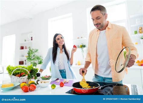 Photo Of Cheerful Adorable Wife Husband Enjoying Cooking Tasty Dinner