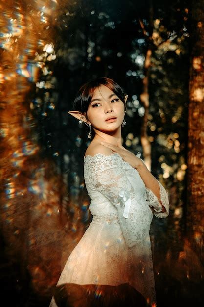 Premium Photo Woman Standing Against Tree