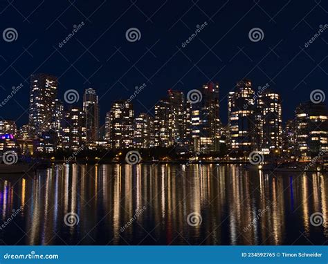 Night View Of Vancouver Skyline Canada In Downtown With Lights Of