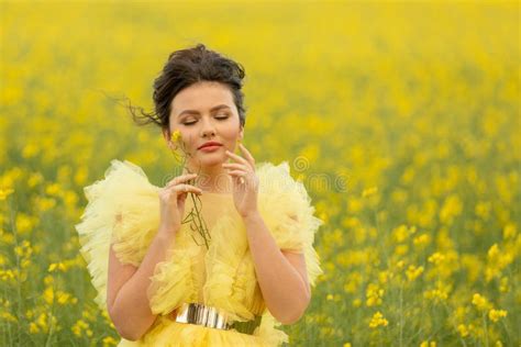 Portrait Of Romantic Brunette Teen Girl Wearing At Yellow Dress Posing