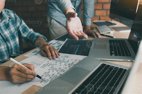 Two Software Developers Are Analyzing Together About The Code Written Into The Program On The