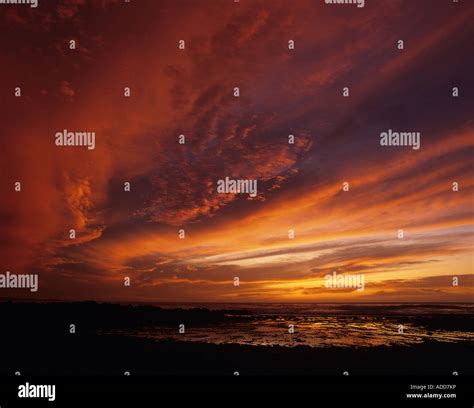 Dramatic Sunset Stratocumulus Clouds Along Coastal Shoreline Near