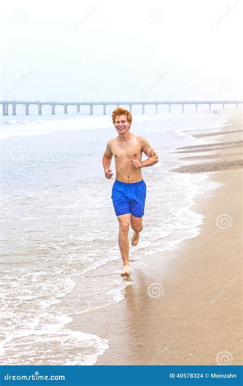 Teen Boy Runs Along The Beach Stock Photo Image Of Running Muscle