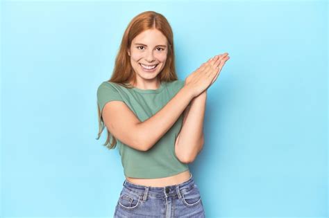 Premium Photo Redhead Young Woman On Blue Background Feeling
