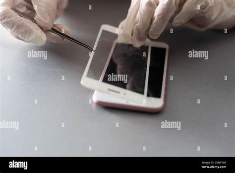 Technician Prepairing To Repair And Replace New Screen Broken And Cracked Screen Smartphone