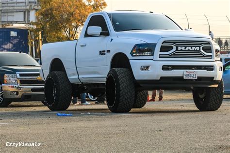 White Ram Truck Parked In Parking Lot