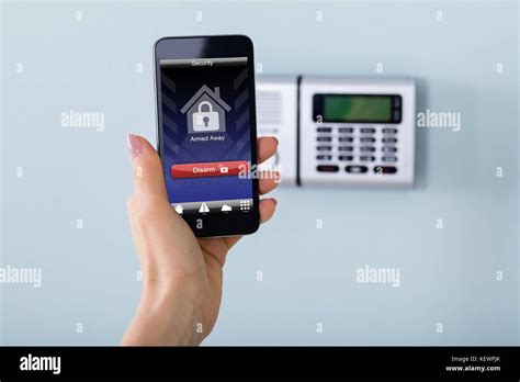 Security Alarm Keypad With Person Disarming The System With Remote