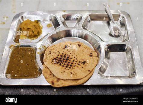 Silver Tray With Chapati Dal And Sabji Vegetable Puree Free Food For Pilgrims In Langar At
