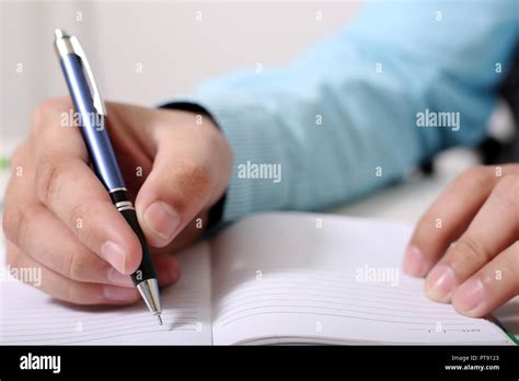 Hand Writing In Notebook Isolated Hi Res Stock Photography And Images Alamy