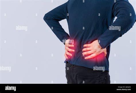 Person With Back Problems On Isolated Background Lumbar Problems