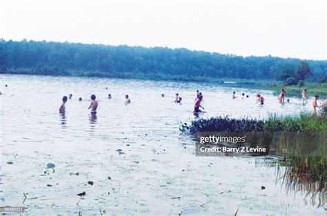 Swimmers In The Lake On The Grounds Of The Woodstock Music And Arts