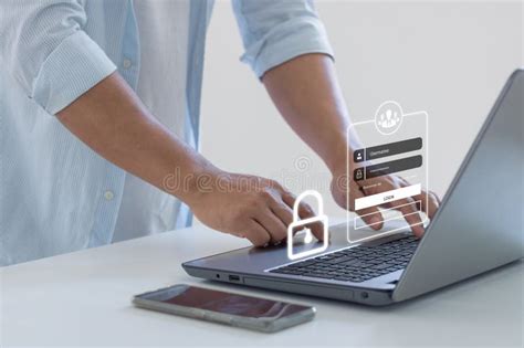 Man Typing Username And Password With A Laptop To Log Into The System