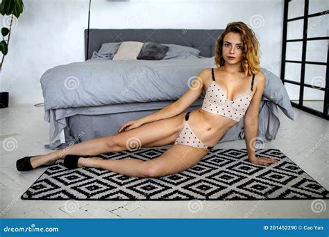 Portrait Of Beautiful Woman With Glamorous Face In Lingerie On Bed