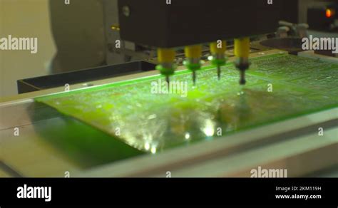 Modern Robot For Electronics Manufacturing Makes A Complex Printed Circuit Board Stock Video