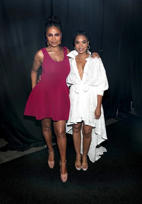 Regina Hall Shines In Sleek Pvc Heels And Crisp White Ensemble At
