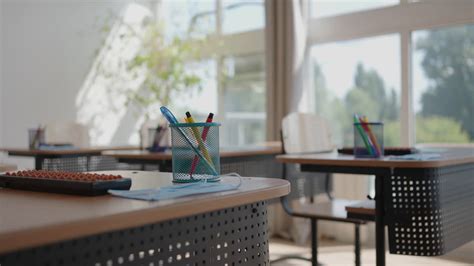 Premium Stock Video Rays Of Light Falling To The Empty Dark Classroom The Camera Panning