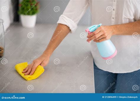 Close Up Picture Of A Woman Disinfecting The Surfaces Stock Image
