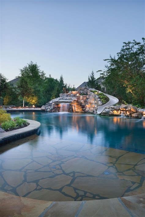 The Natural Boulder Waterfall Of This Lagoon Style Pool Definitely Attracts Attention The Pool